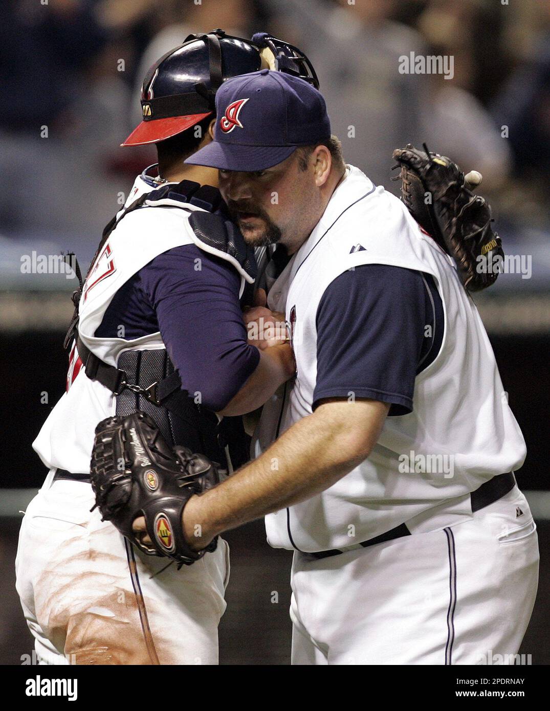 Cleveland Indians pitcher Bob Wickman, right, hugs catcher Victor ...