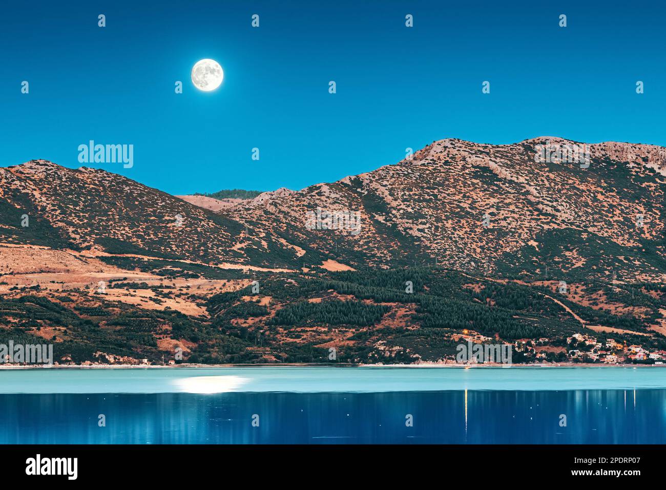 A mystical full moon shines over Lake Egidrir in Turkey. Night ...