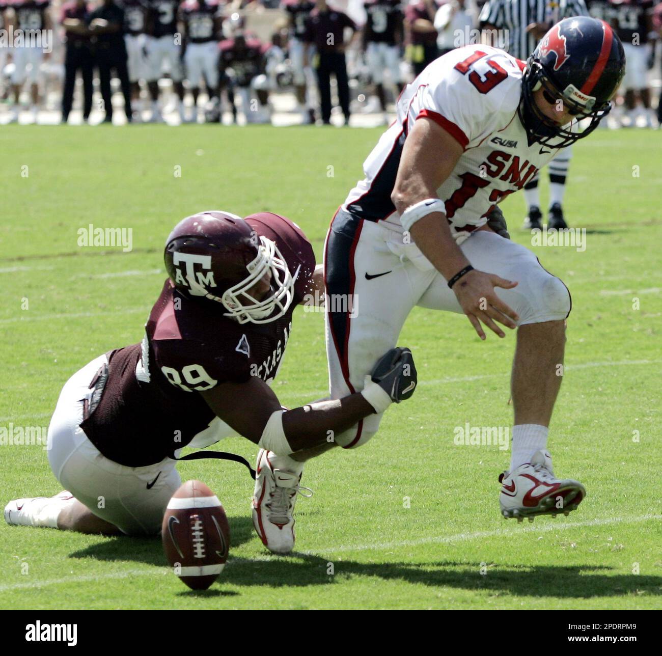 SMU quarterback Jerad Romo, right, fumbles near the goal line in front ...