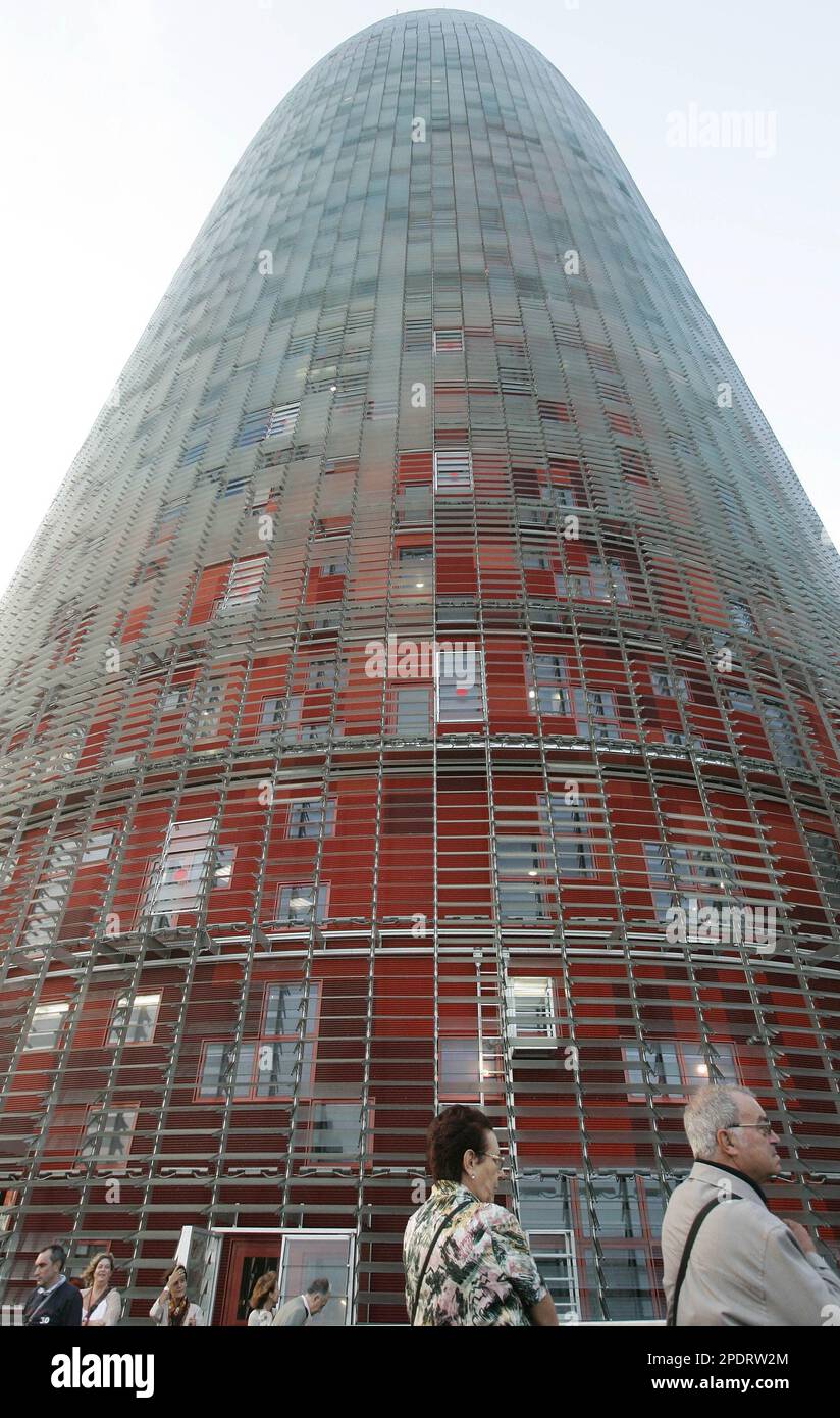 People walk past the Agbar tower that was inaugurated by Spain's King ...