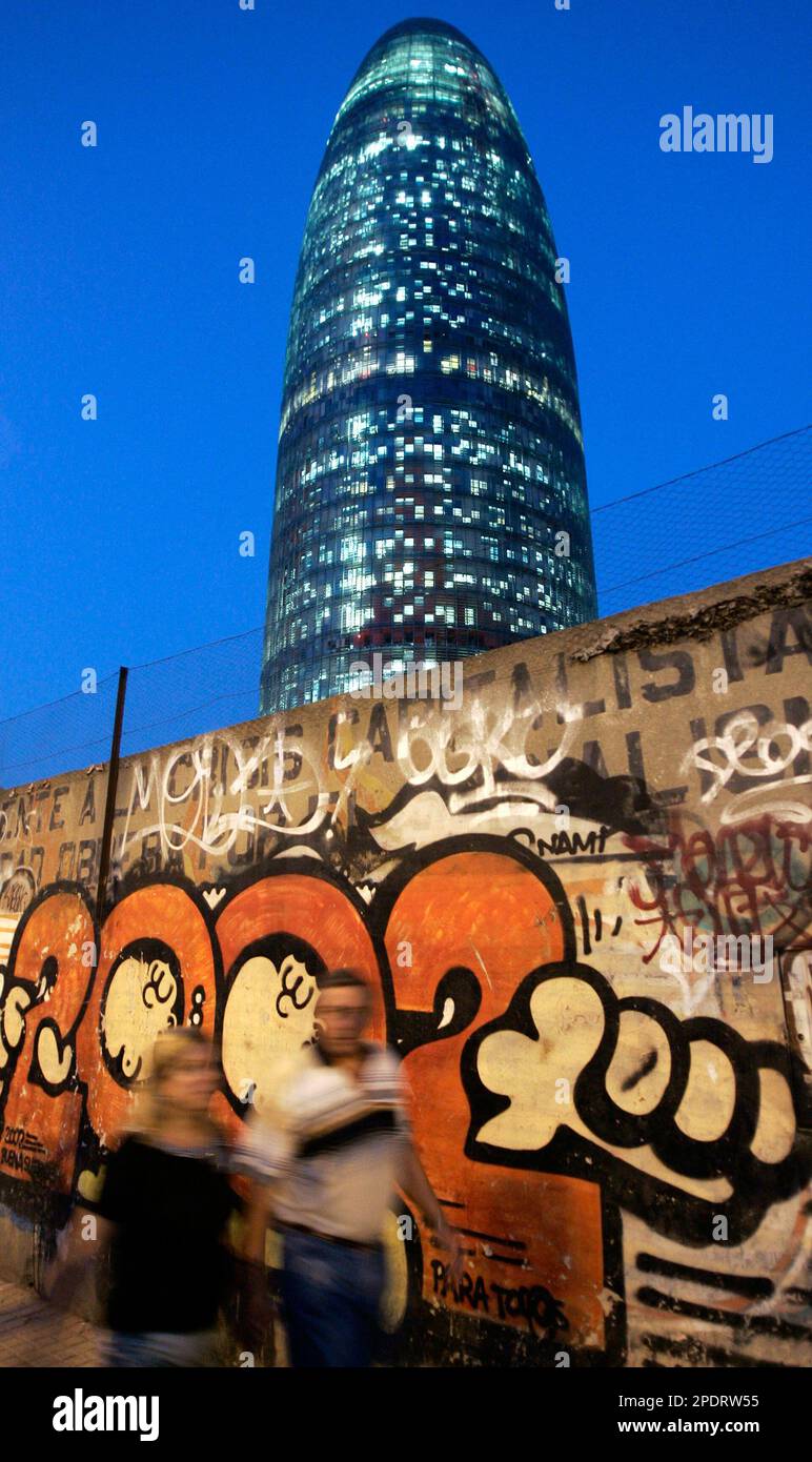 People walk past the Agbar tower that was inaugurated by Spain's King ...