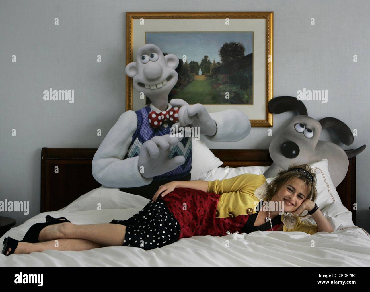 Helena Bonham Carter curls up with Wallace, left, and Gromit figures in ...
