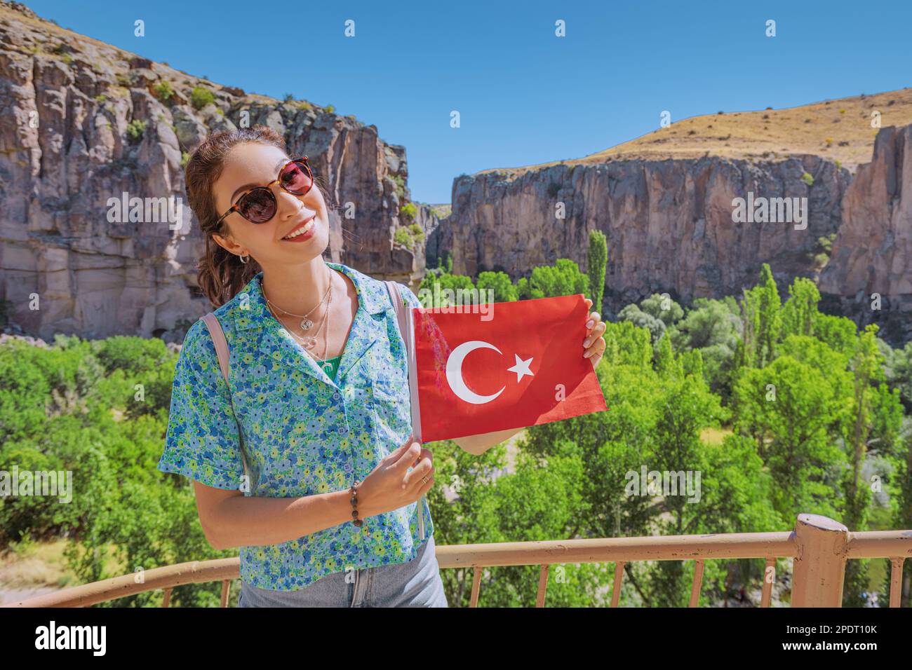 Happy girl with national Turkish flag with famous Ihlara valley in ...