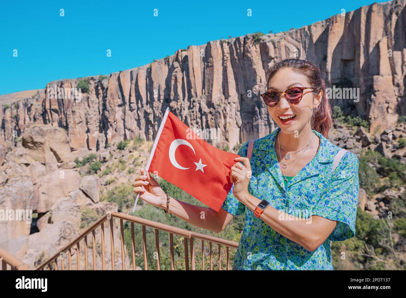 Happy girl with national Turkish flag with famous Ihlara valley in ...