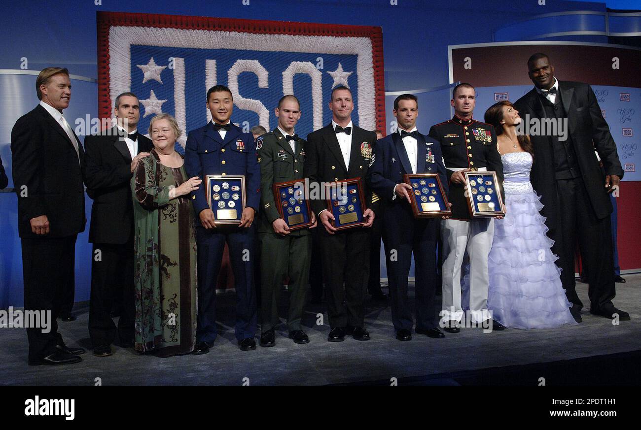 From left, John Elway, Henry Rollins, Kathy Kinney, USO Coast Guardsman of the Year Aviation ...