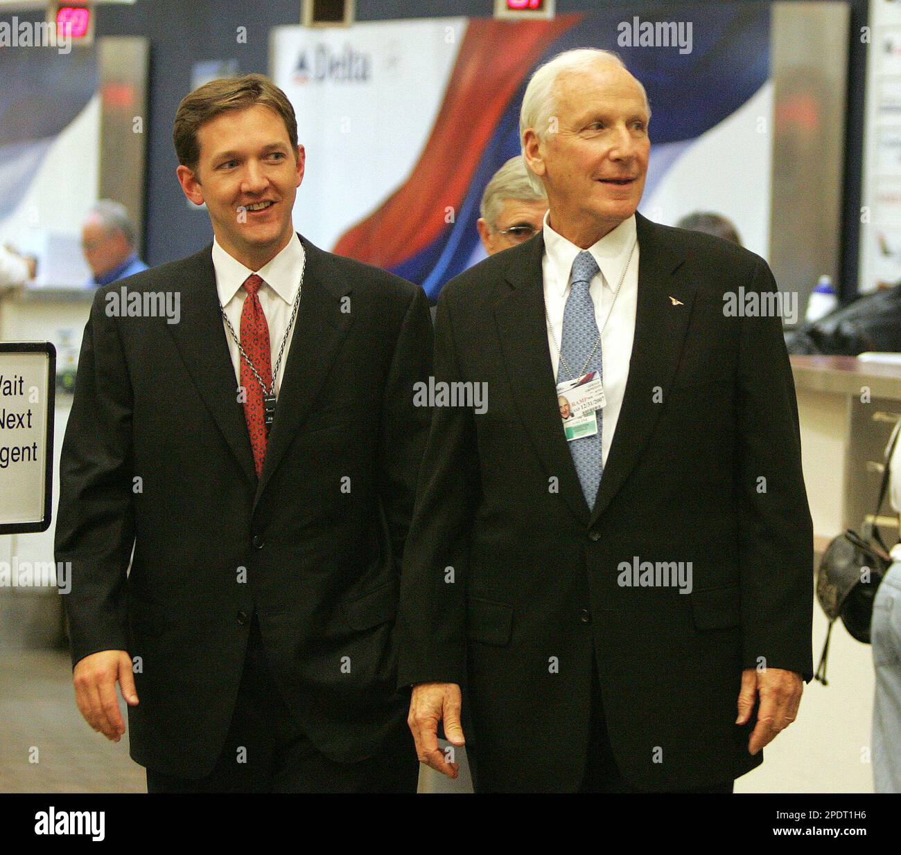 Delta Airlines CEO Gerald Grinstein, right, and COO Jim Whitehurst walk ...