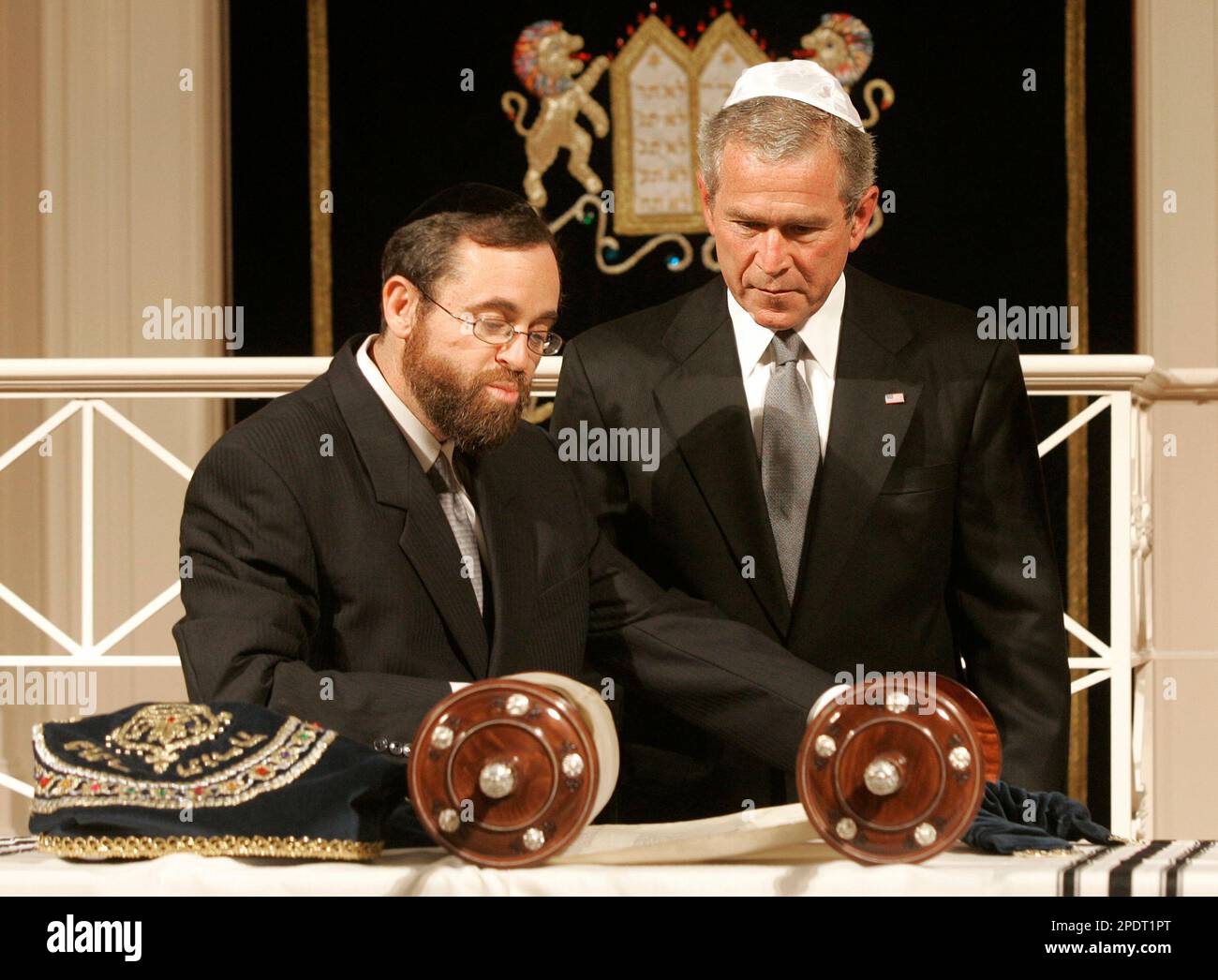 President Bush is shown the torah by Rabbi Zvi Teitelbaum, left, at the ...