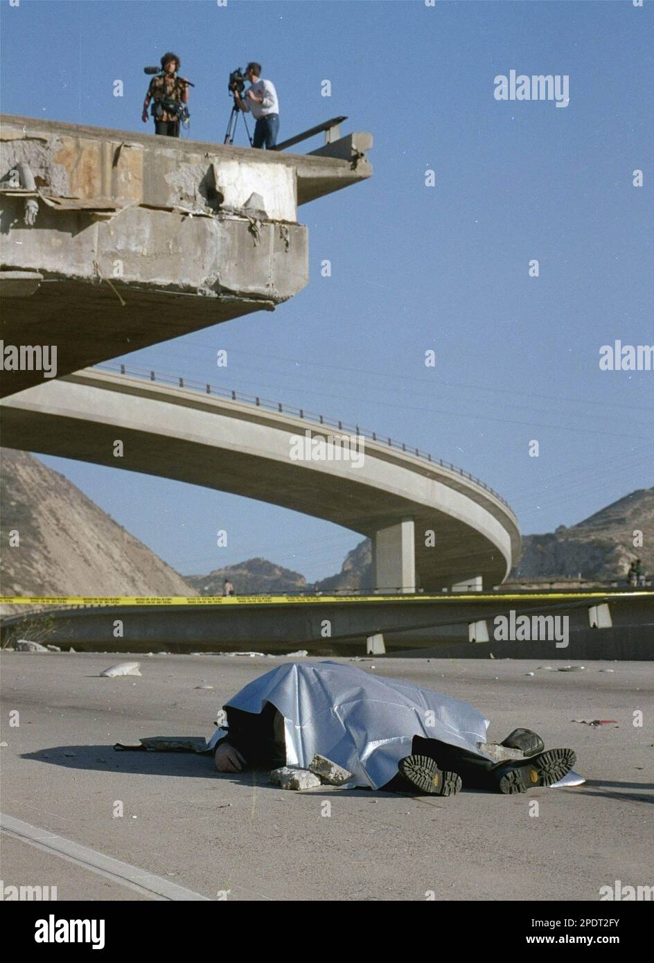 ** FILE ** The body of Los Angeles Police motorcycle officer Clarence ...