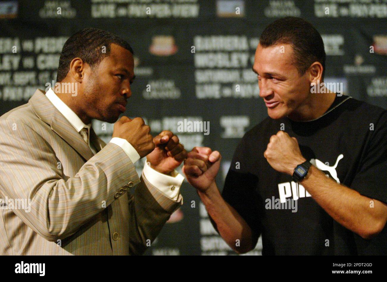 Shane Mosley, left and Jose Cruz pose during a news conference at the ...