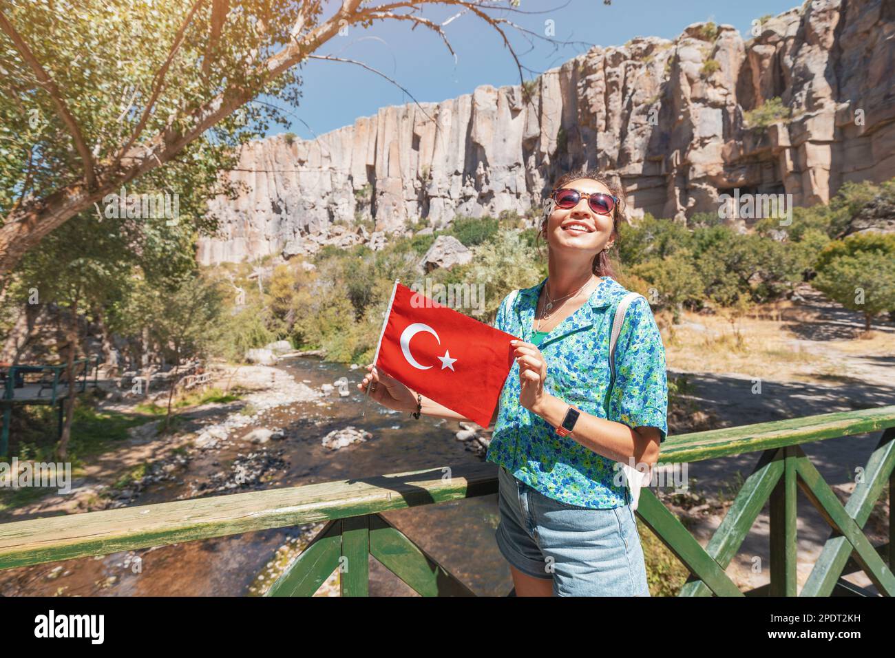 Happy girl with national Turkish flag with famous Ihlara valley in ...