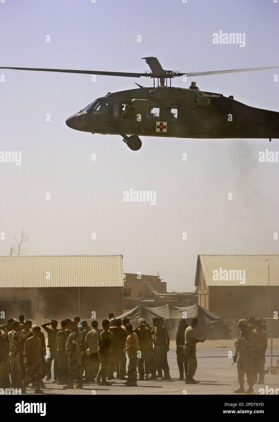 Iraqi Army soldiers and Iraqi Special Police Commandos watch as a U.S ...