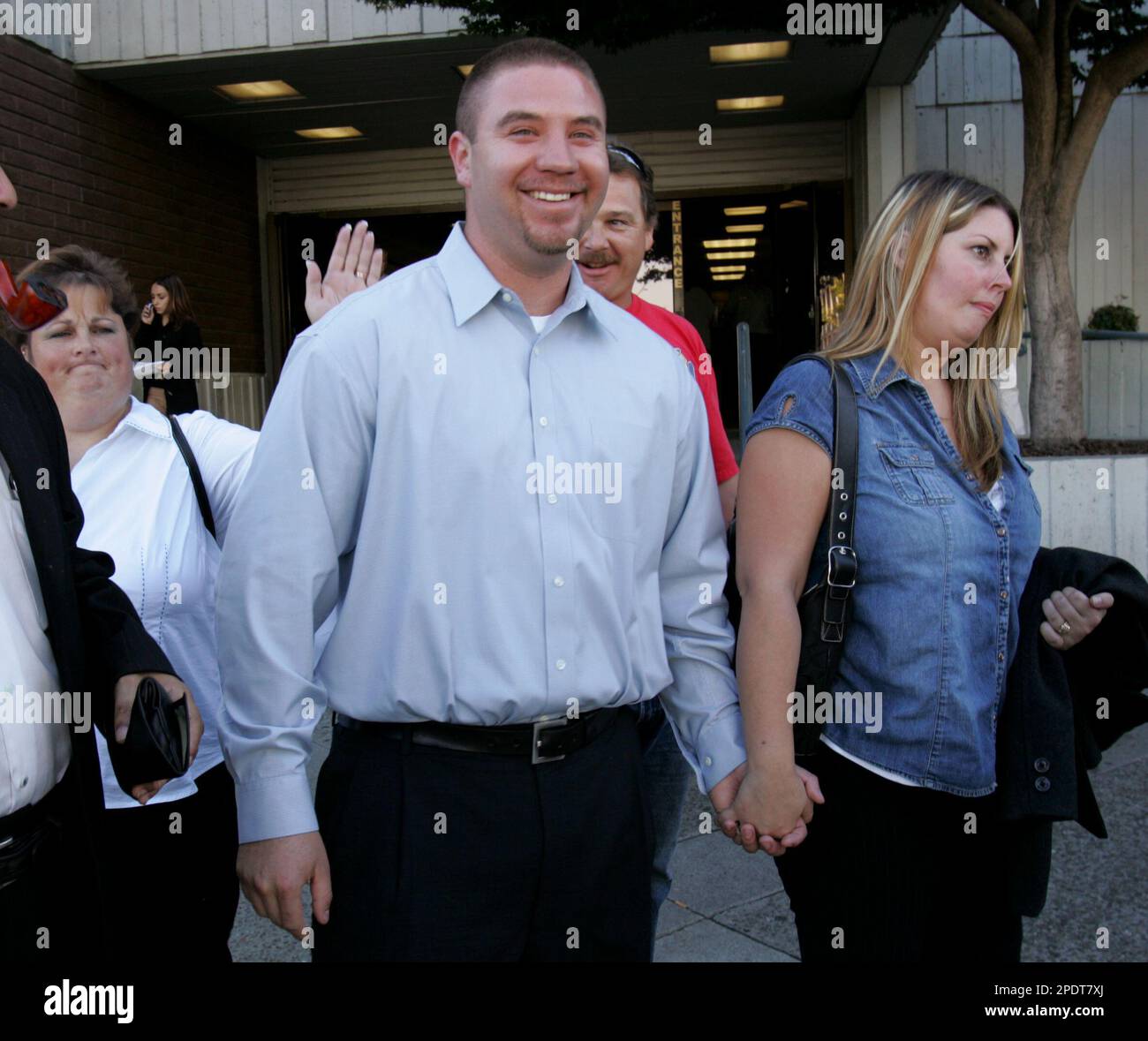 Jason Cazares, center, smiles as he leaves a Hayward, Calif ...