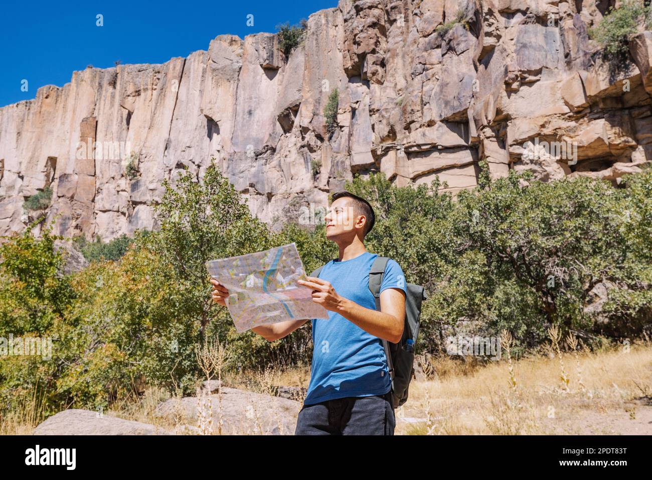 Male hiker looking at map in Ihlara valley, Cappadocia Stock Photo - Alamy