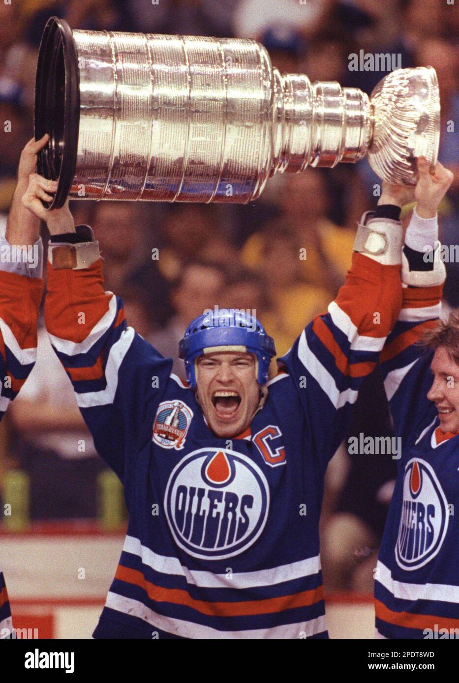Edmonton Oilers captain Mark Messier holds up the Stanley Cup trophy ...