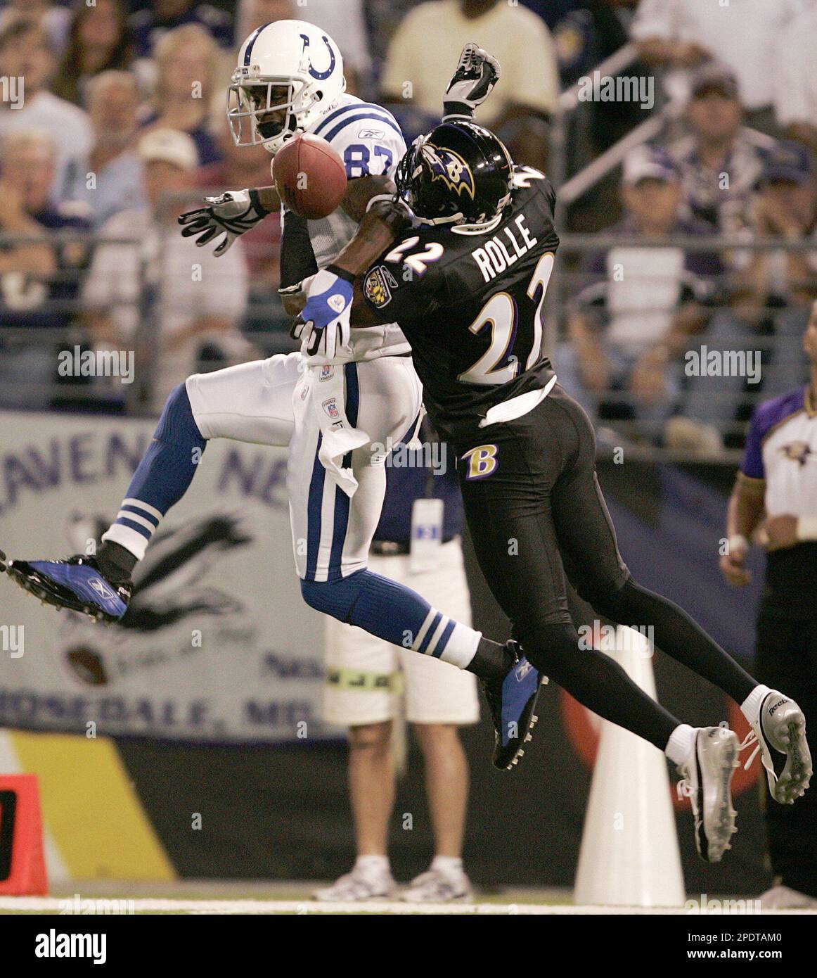 Baltimore Ravens cornerback Samari Rolle, right, breaks up a pass ...