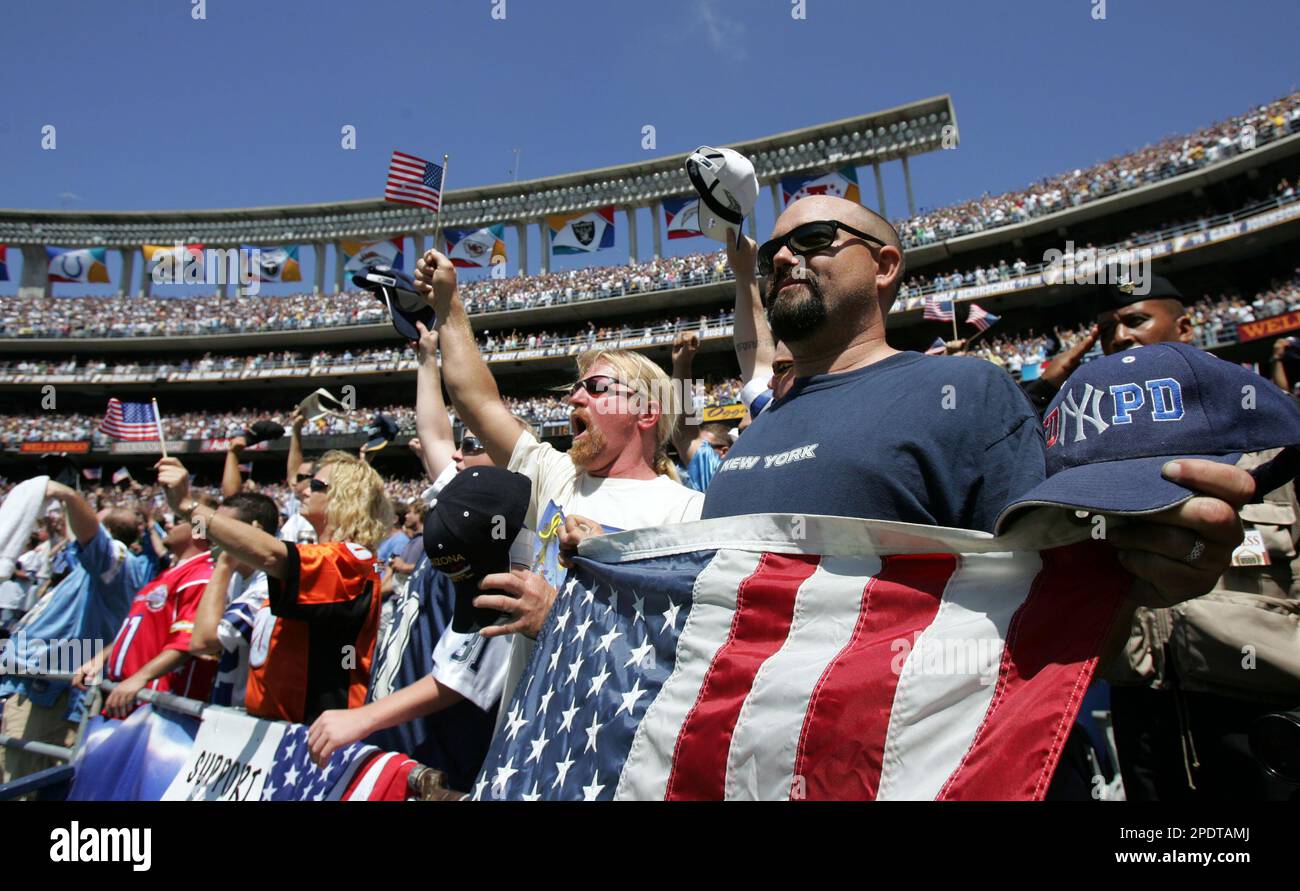 Fans react to the 9/11 anniversary announcement before the start of the ...