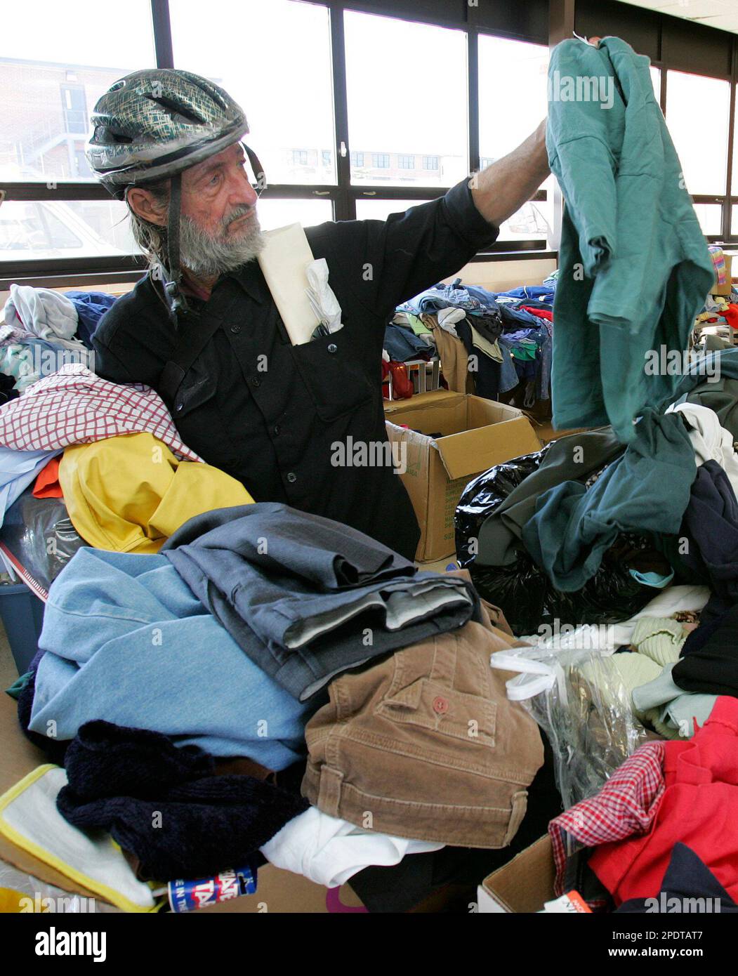 Hurricane Katrina refugee Jay Saucier of New Orleans sorts through ...