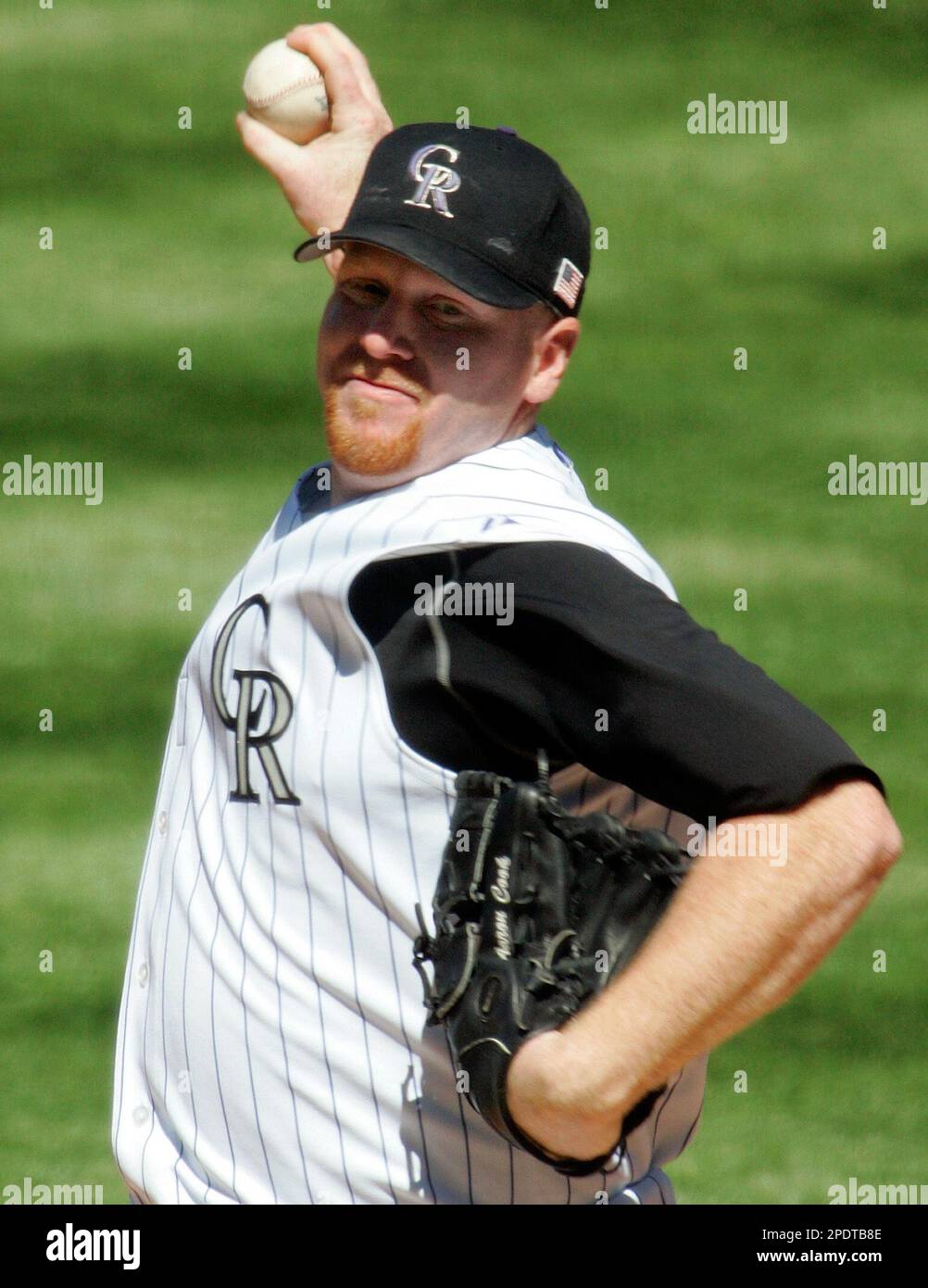 Colorado Rockies starting pitcher Aaron Cook winds up to throw to the ...