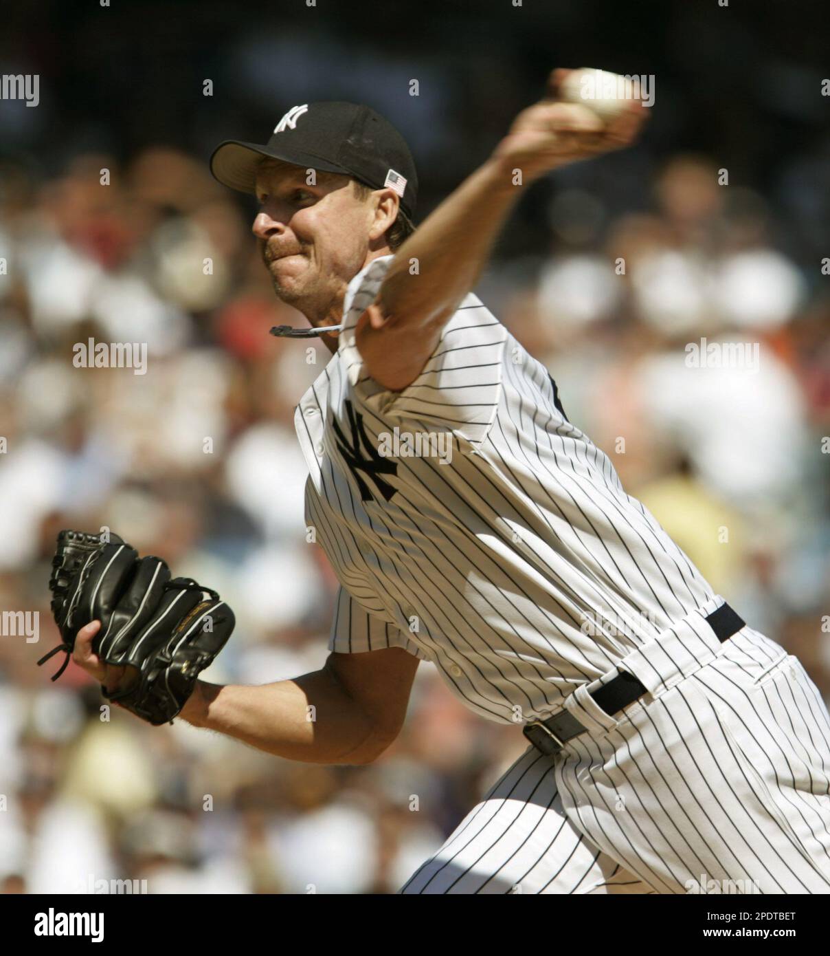New York Yankees pitcher Randy Johnson delivers a pitch in the Yankees ...