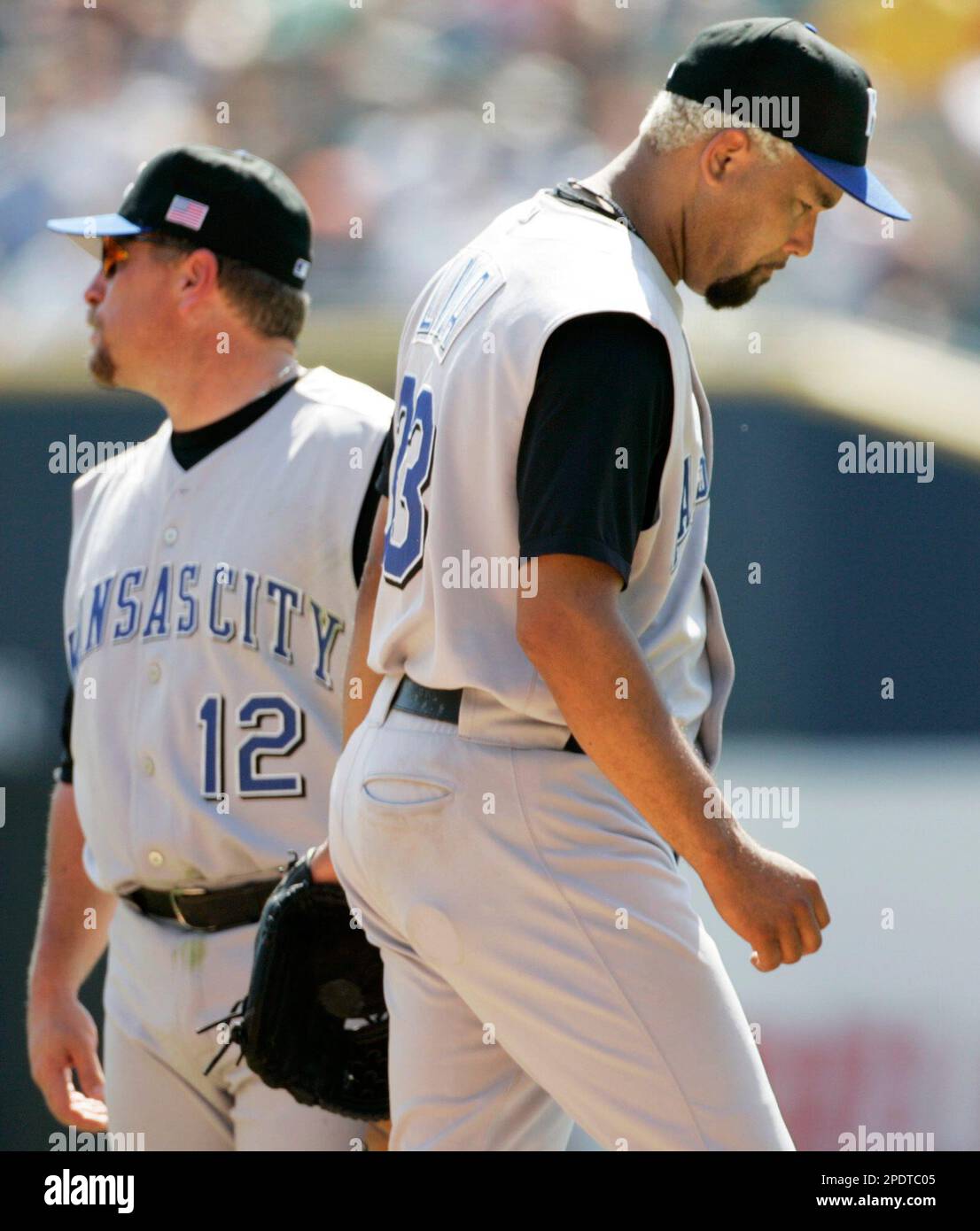 Kansas City Royals starter Jose Lima, right, walks past first baseman ...
