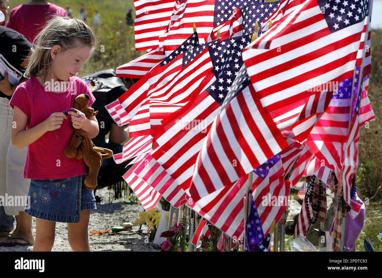 Taylor Prokosch of Delmont, Pa., visits the temporary memorial to ...