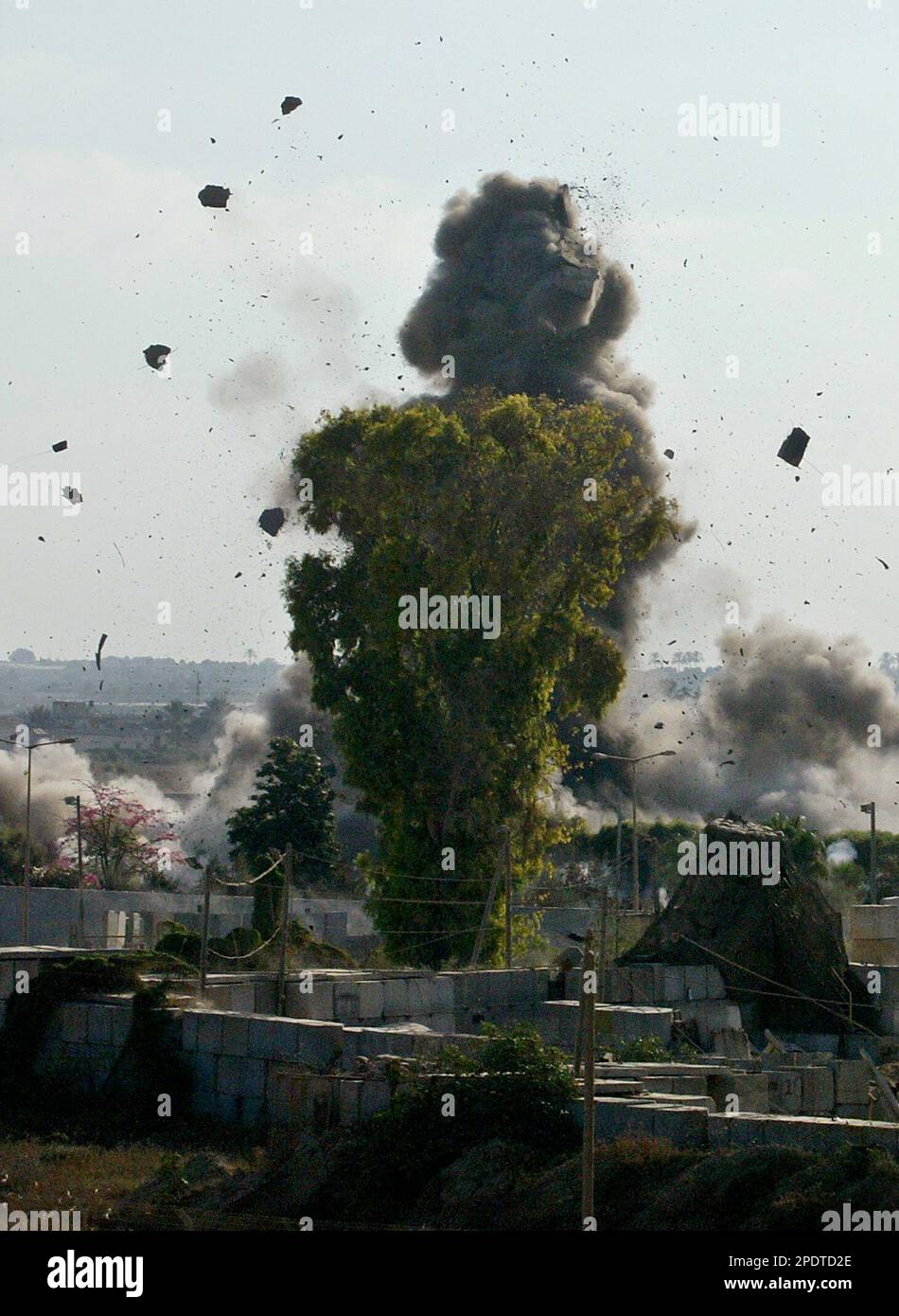 A controlled Israeli Army explosion is seen as the liaison offices of ...