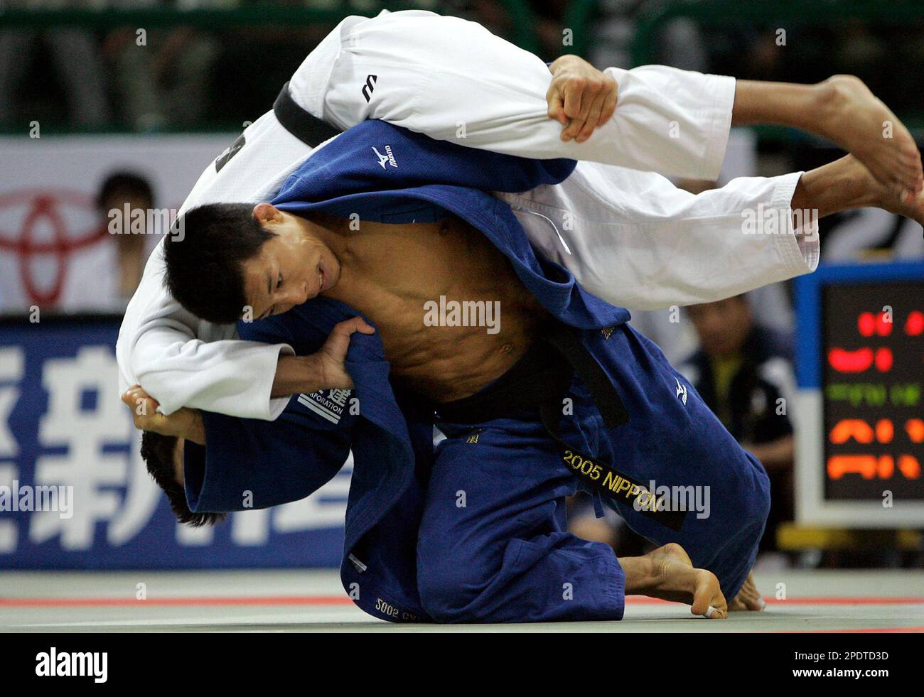 Japan's Tatsuaki Egusa throws Argentina's Miguel Albarracin, in white ...