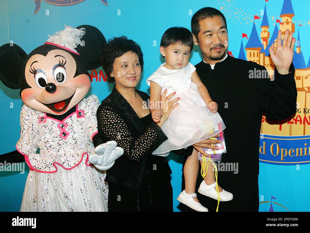 Mainland Chinese actor Zhang Guo-lin, right, his wife and daughter pose ...