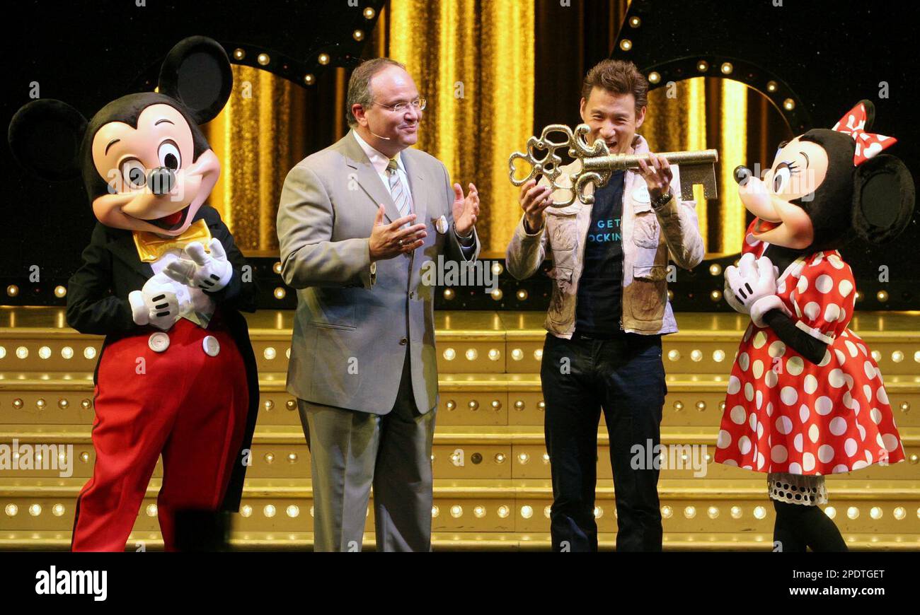 Hong Kong singer Jacky Cheung, second from right, and Walt Disney Parks ...