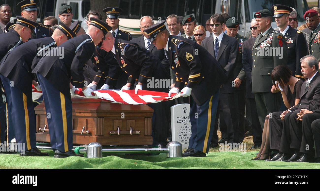 Hye Jarak, the widow of Army Master Sgt. Ivica Jerak, right, wipes away ...