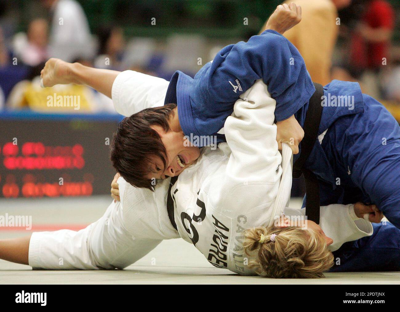 Japan's Ayumi Tanamoto pins down Portugal's Andreia Cavalleri in the Women's -63kg Judo at the ...
