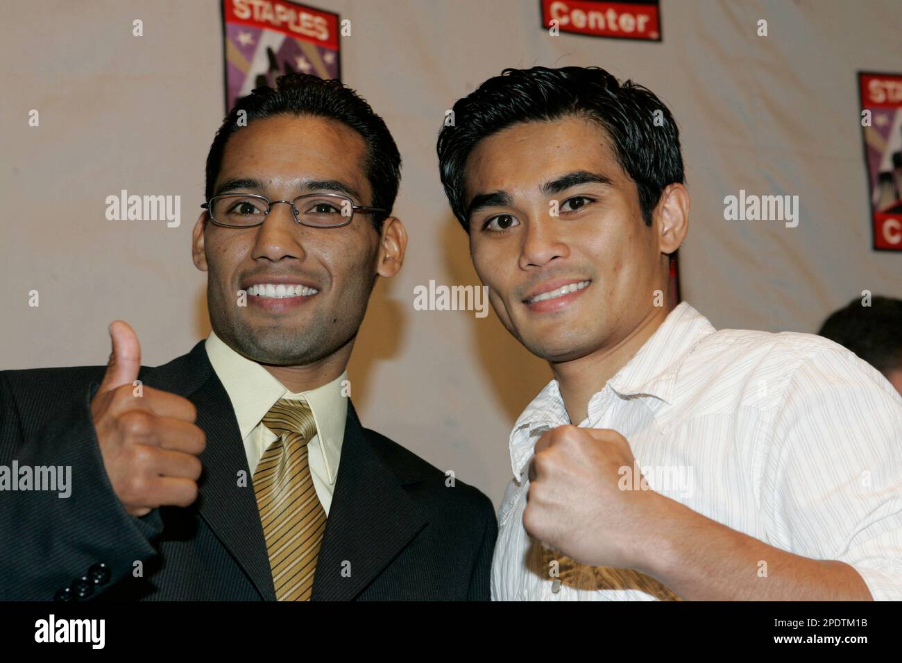 Boxers Eric Ortiz, left, and Brian Viloria pose for a photo Thursday ...