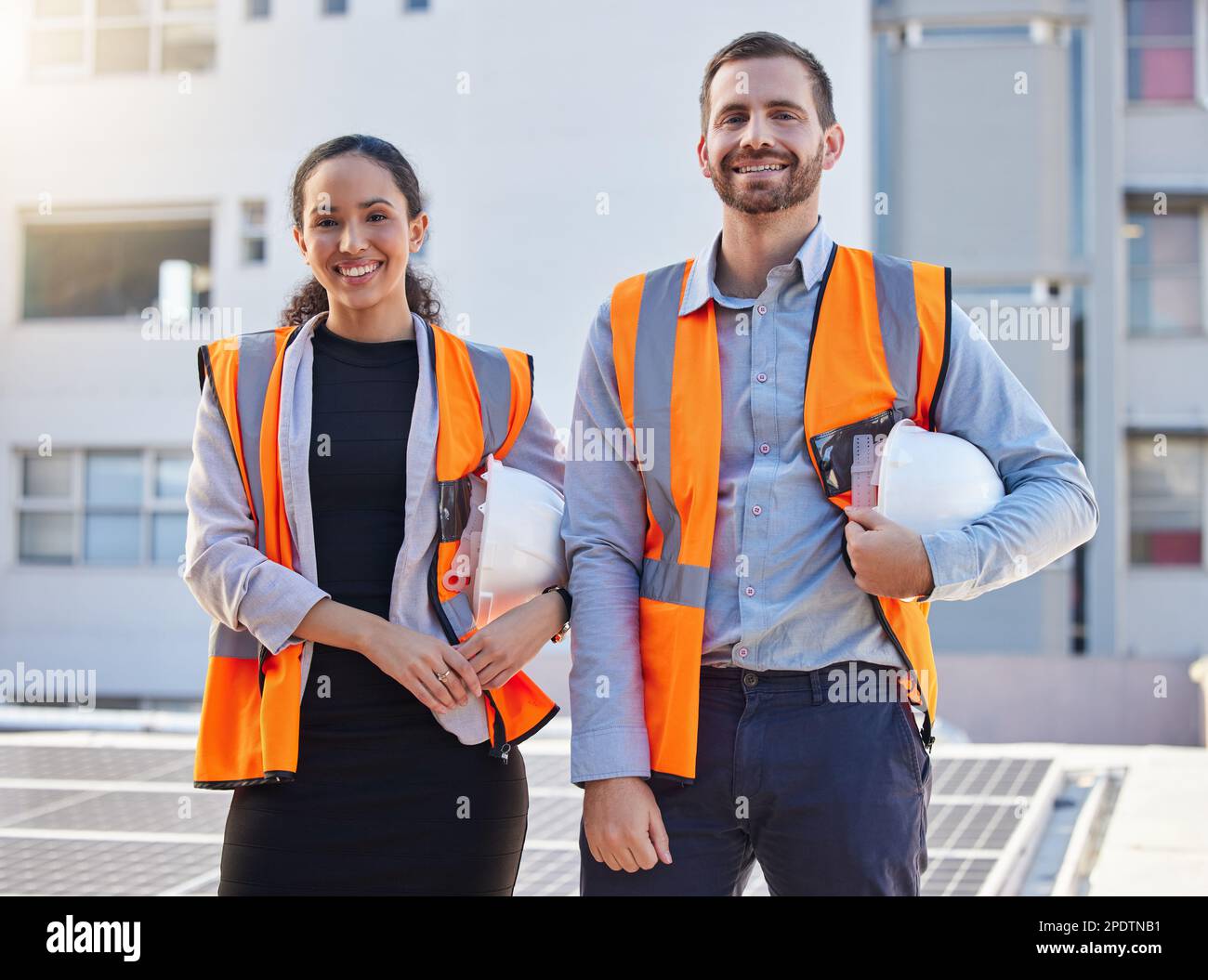 Team portrait of engineering people in outdoor, construction site ...
