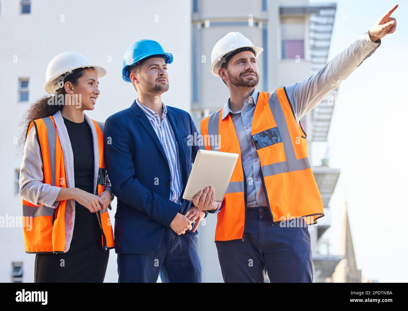 Architecture people pointing for outdoor planning, teamwork or ...