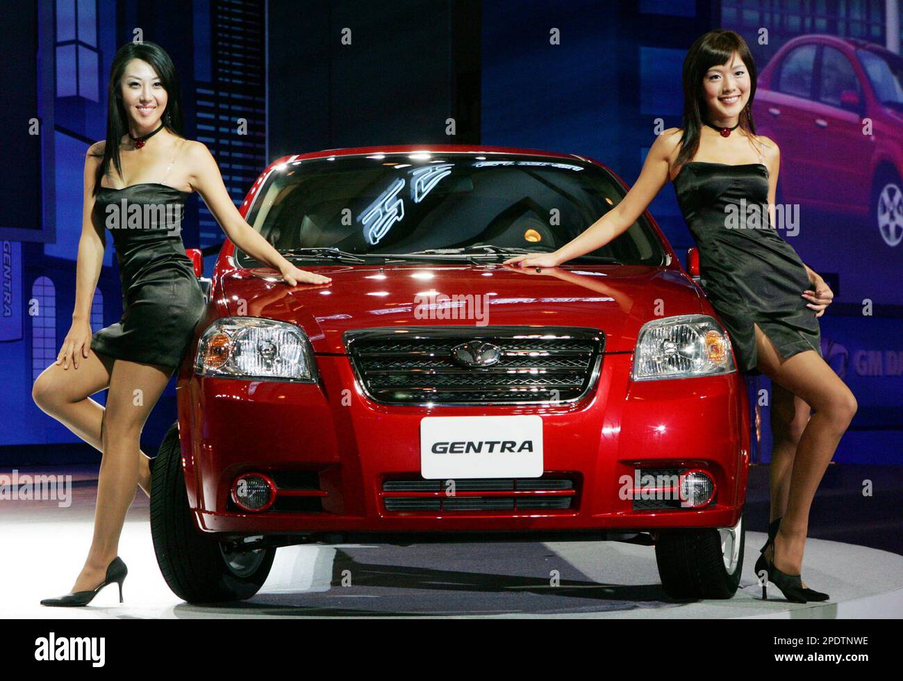 Models pose with GM Daewoo's Gentra during a press conference in Seoul Thursday, Sept. 8, 2005 ...