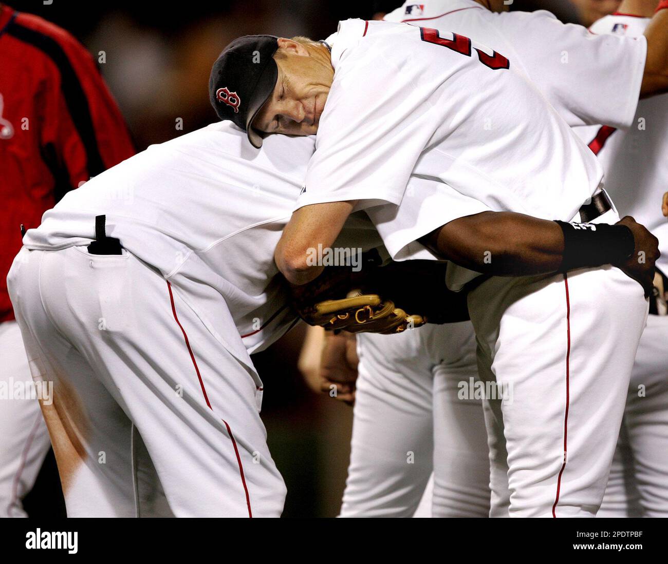 Boston Red Sox relief pitcher Mike Timlin, right, bear hugs with ...