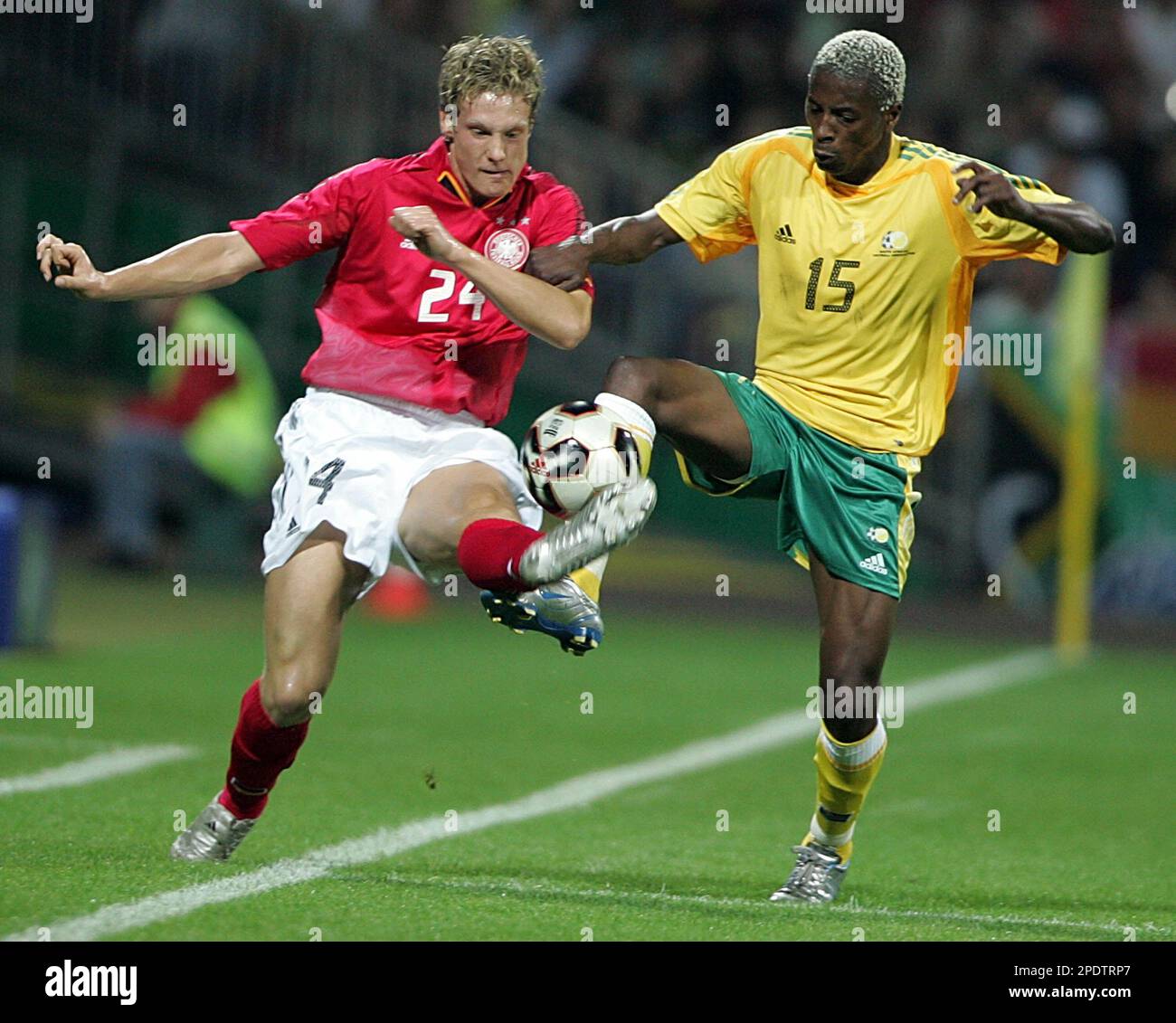 South Africa's Sibusiso Zuma, right, struggles with Germany's Marcell ...
