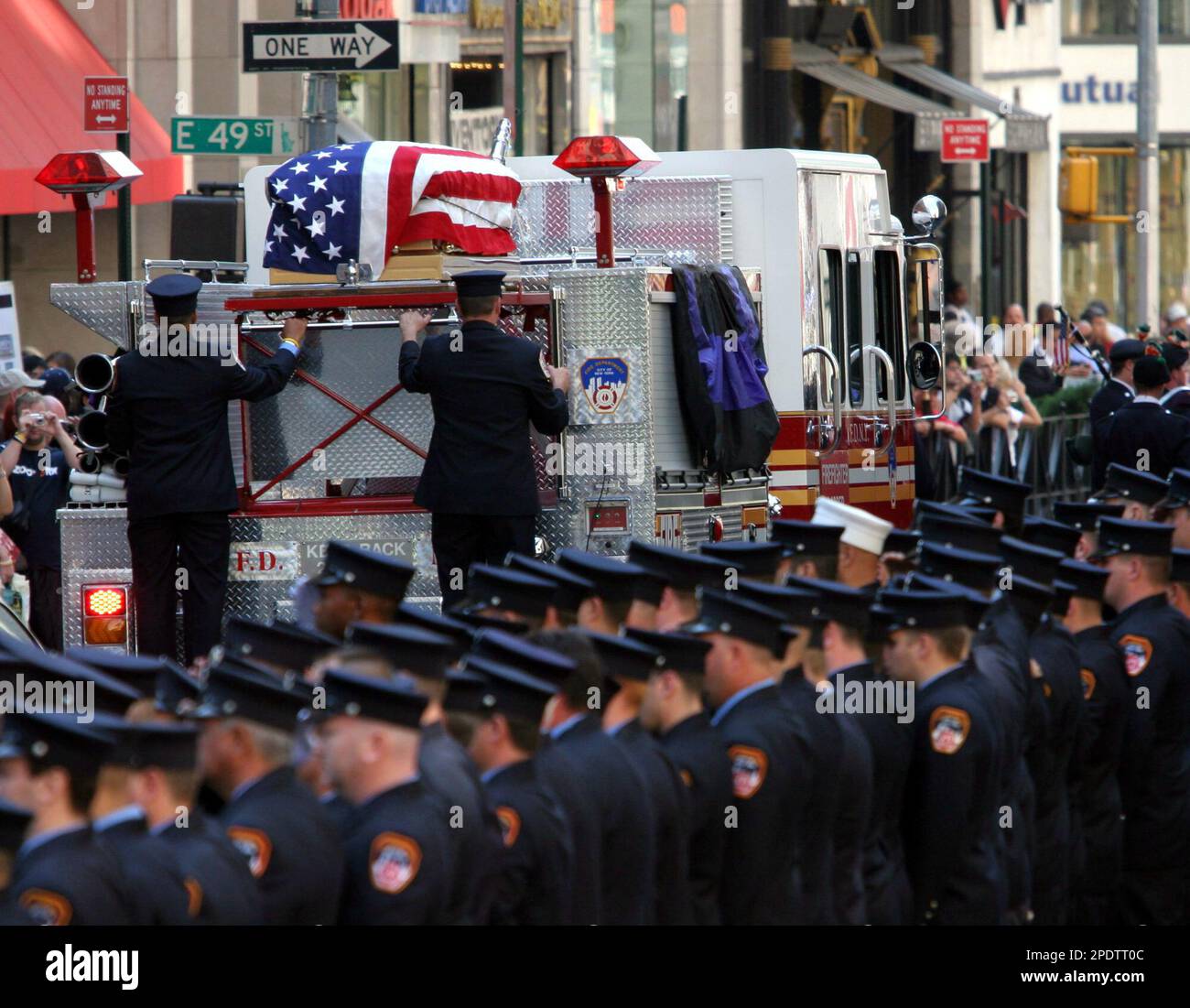 The flag-draped casket holding the remains of firefighter Gerard ...