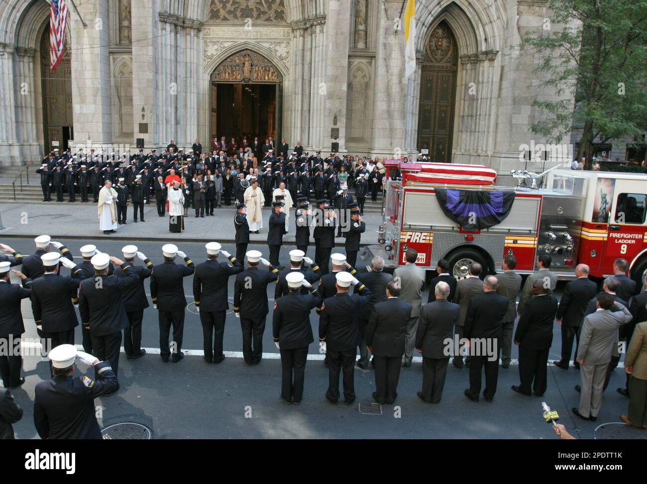 The flag-draped casket holding the remains of Firefighter Gerard ...