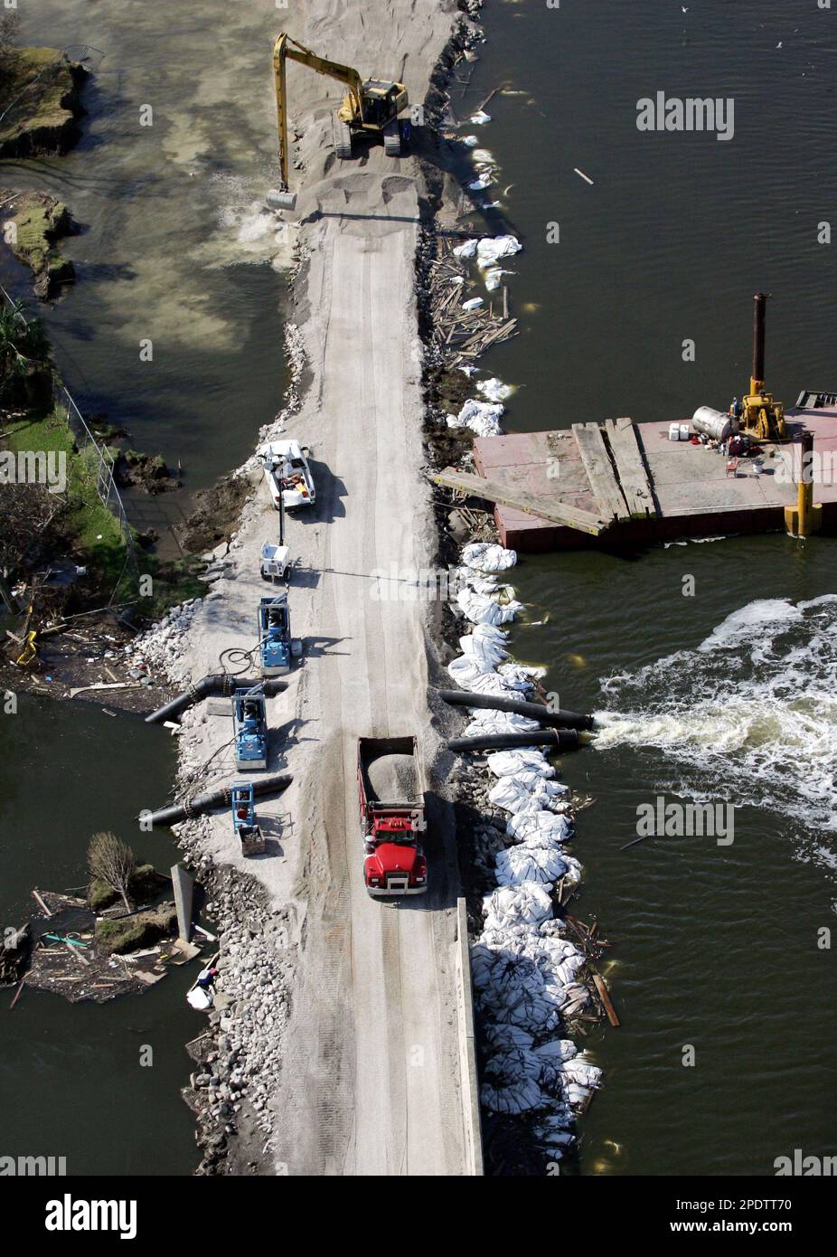 Temporary pumps move floodwaters through the repaired 17th Street canal levee in the aftermath ...