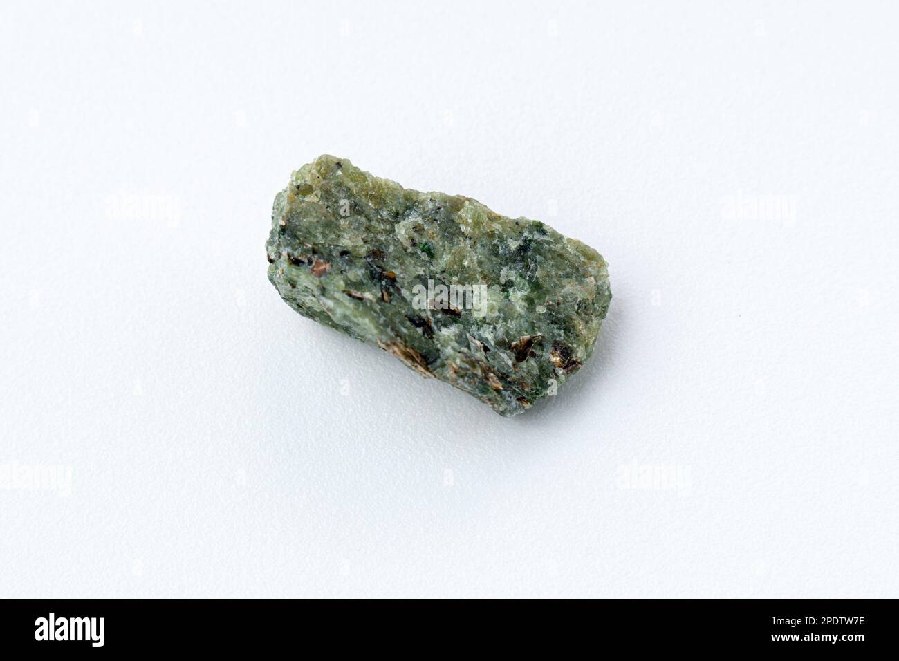 Natural chrysolite, olivine green color transparent raw crystal, close ...