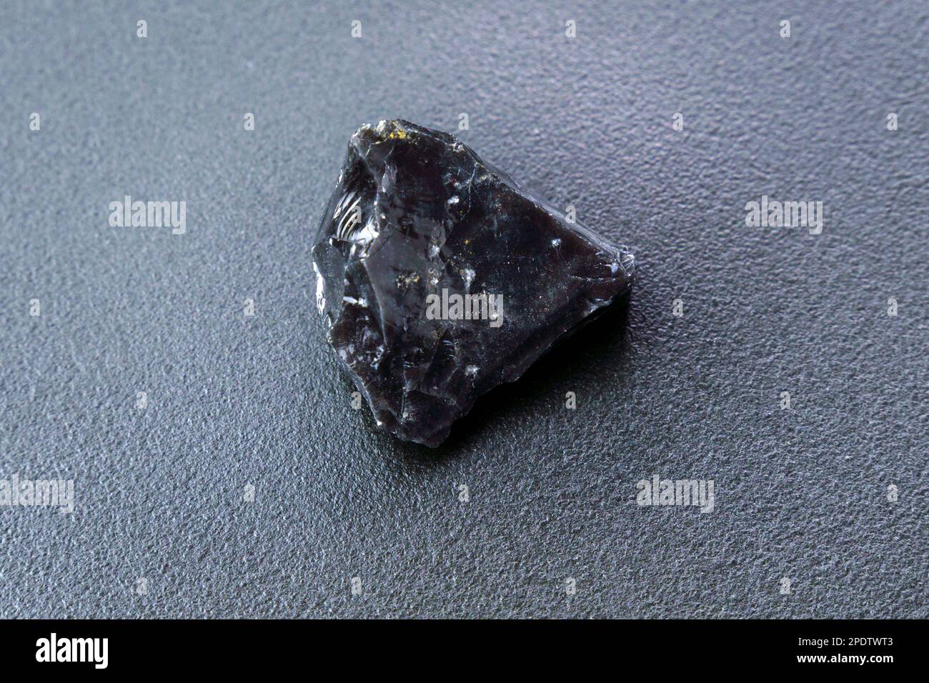Obsidian rock. Volcanic material. Rough edges. Sharpest rock black ...