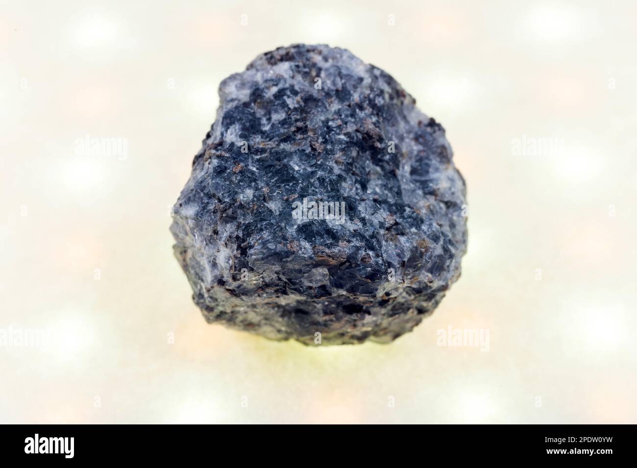 Crystal of cordierite iolite gem stone, raw mineral, white background ...