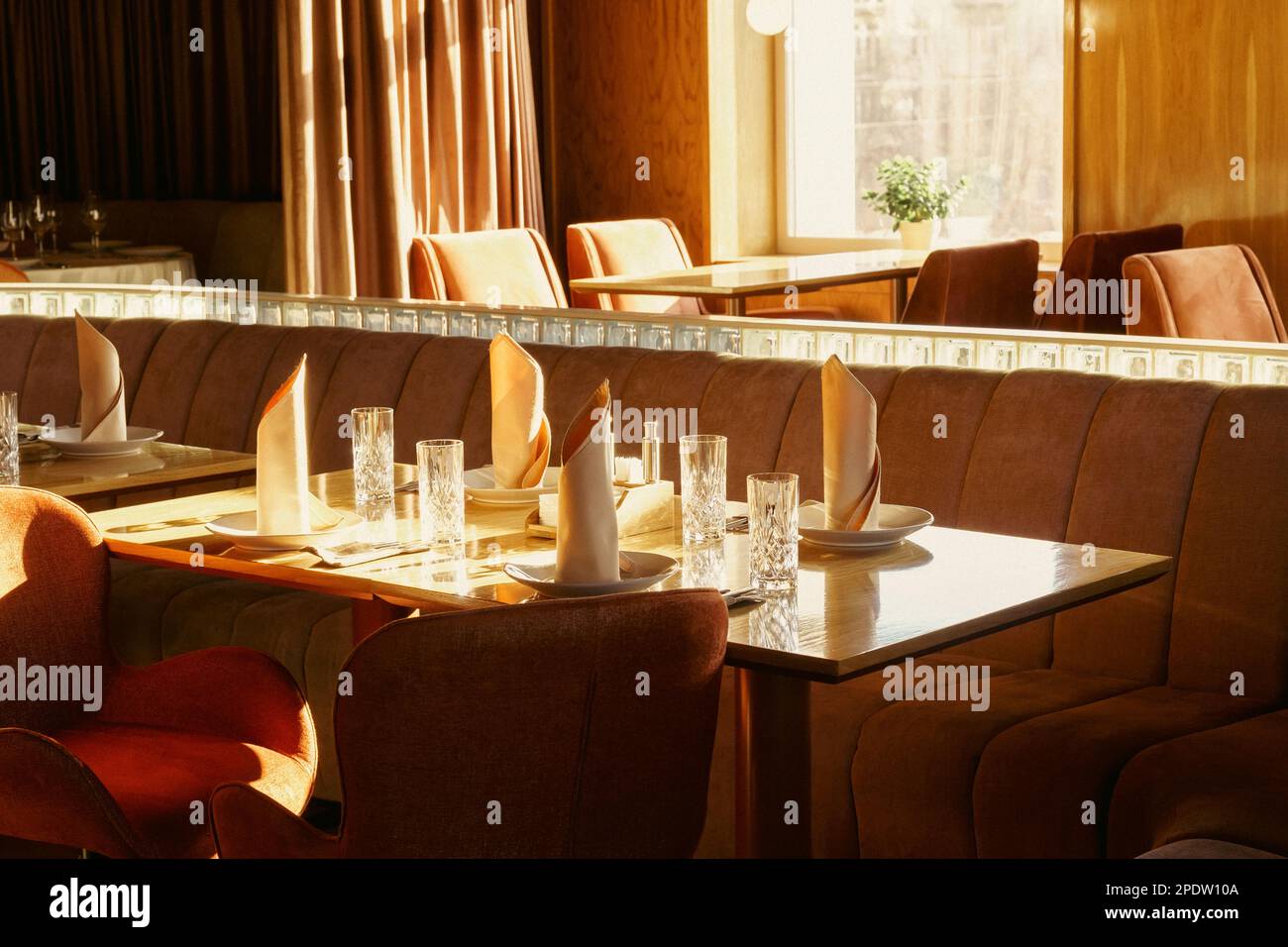 Empty dining tables in the restaurant early in the morning. Deserted ...