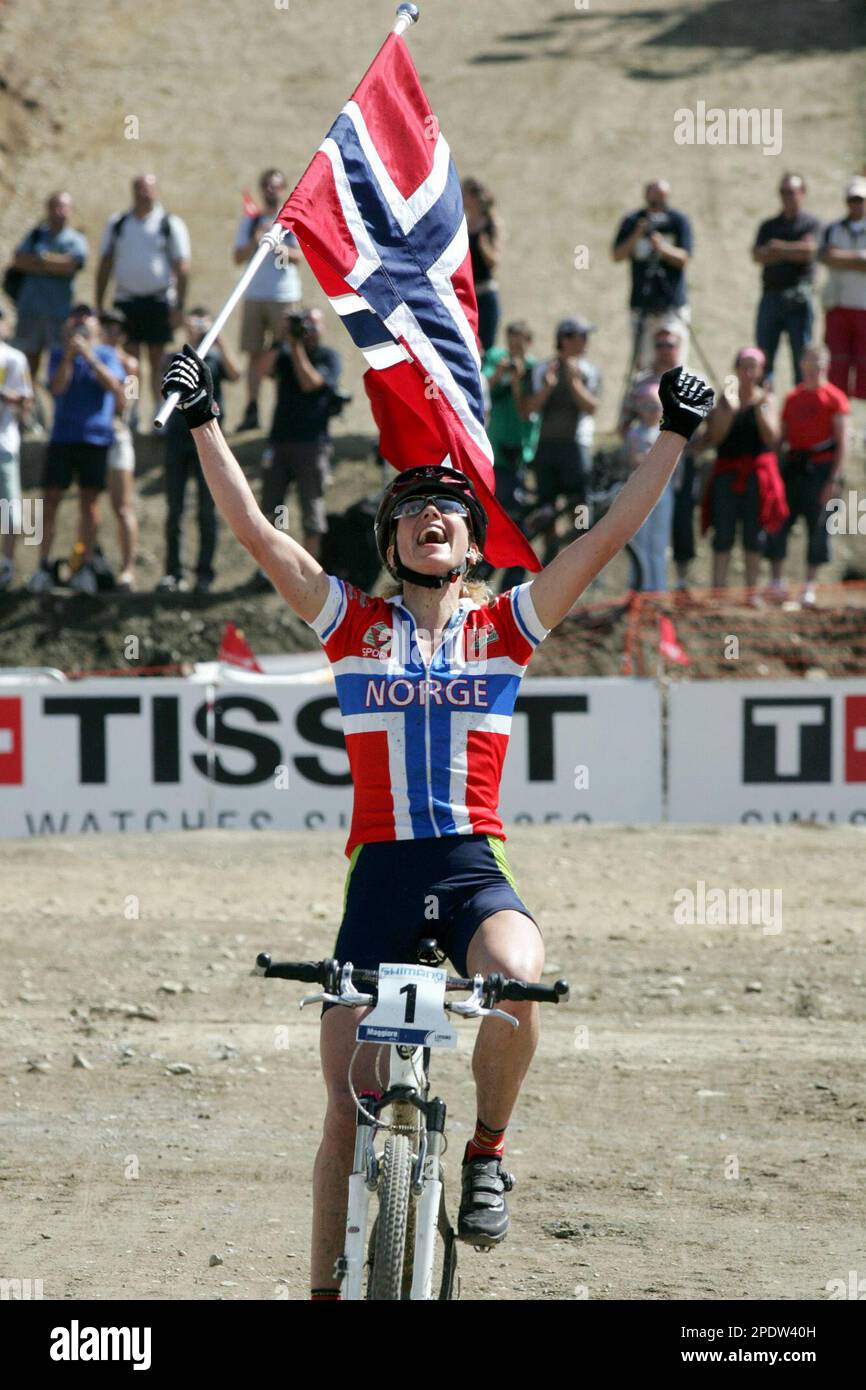 Norways' Gunn Rita Dahle waves a national flag as she celebrates after ...