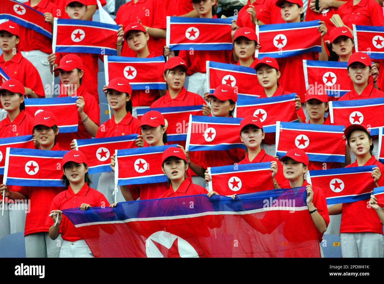 North Korean women show their national flags as they cheer on their ...