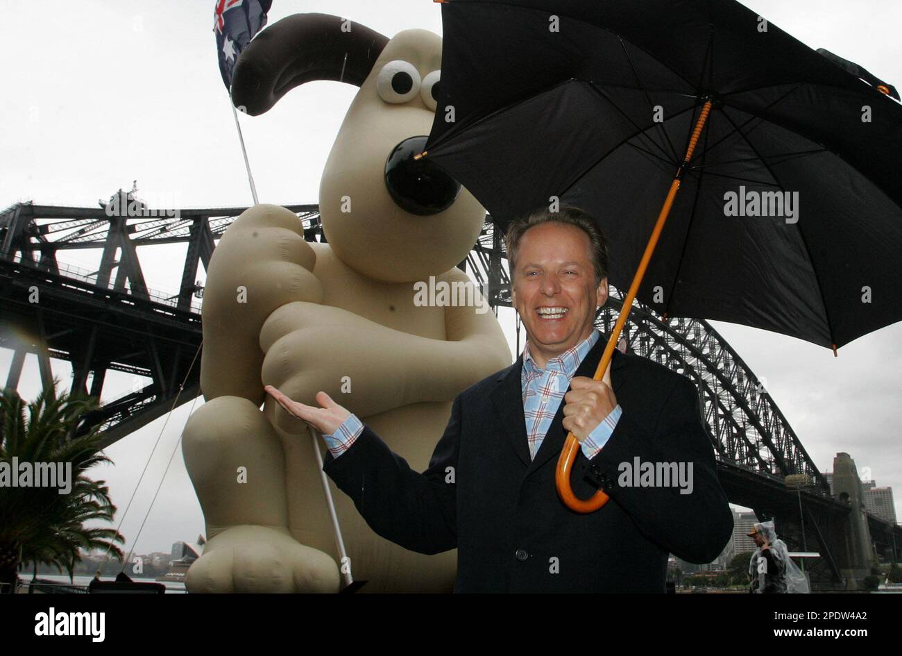 Director Nick Park center, asks about the weather while he stands in ...