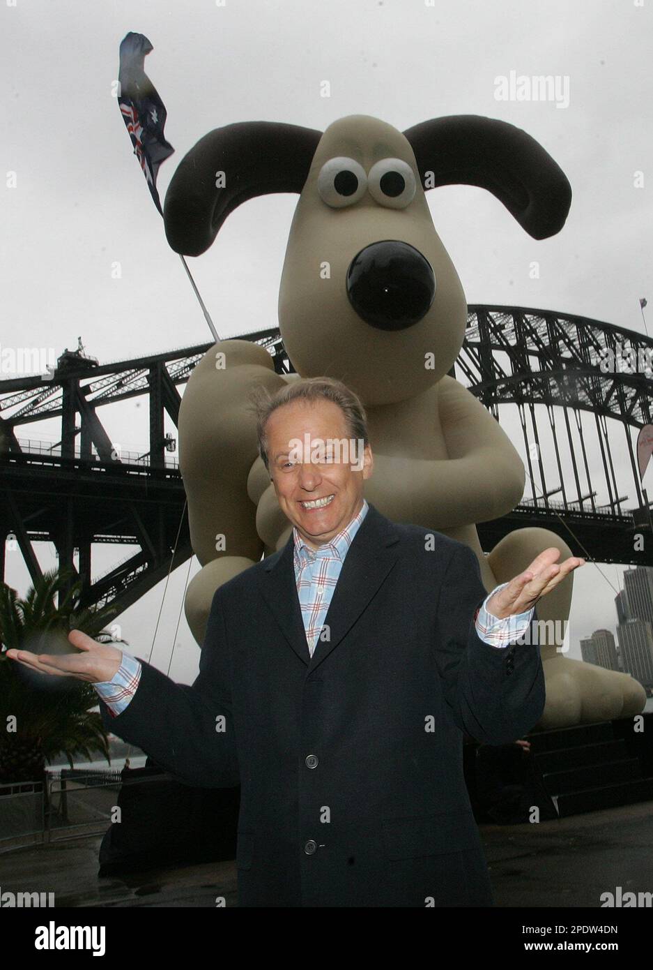 Director Nick Park center, asks about the weather while he stands in ...