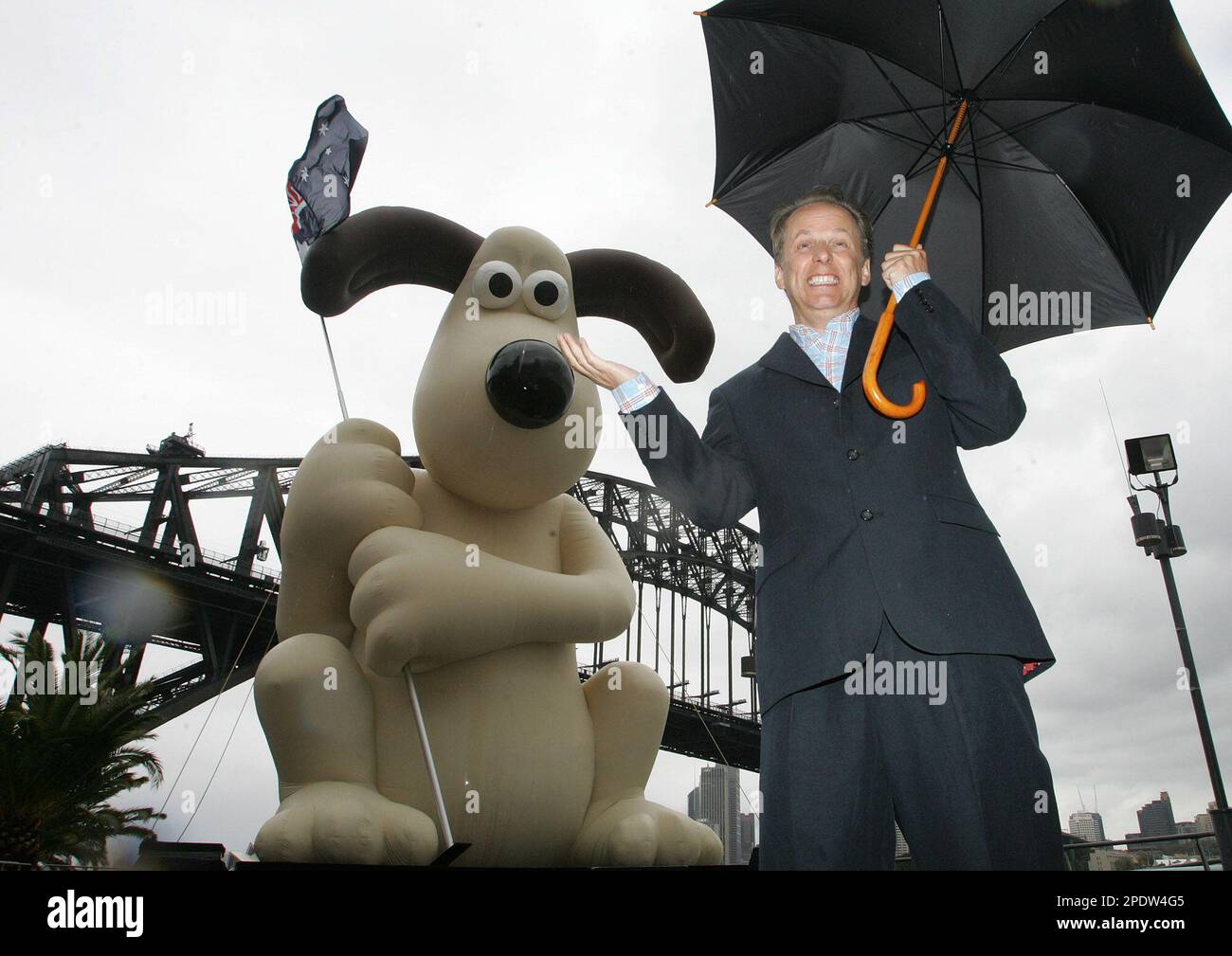Director Nick Park center, asks about the weather while he stands in ...