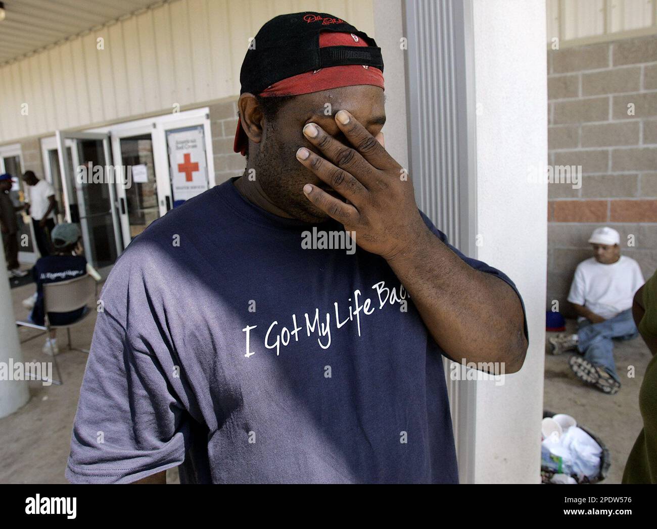 Laurie Red Jr. of New Orleans wipes tears away as he talks about his ...